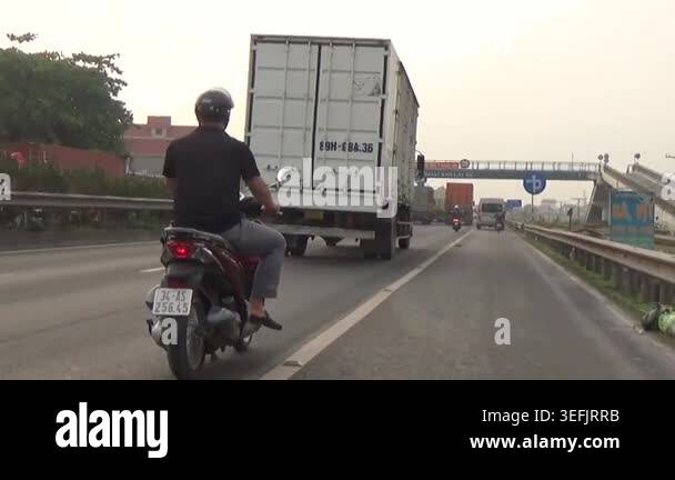 Street scenes in Hai Phong city. Traffic flows continuously at ...
