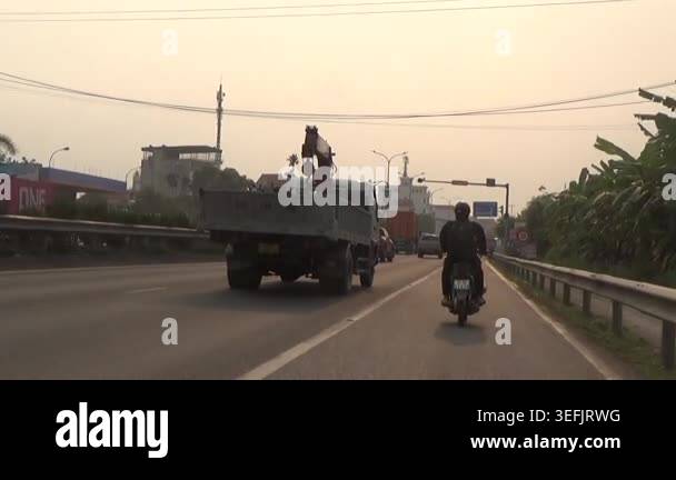 Street scenes in Hai Phong city. Traffic flows continuously at ...