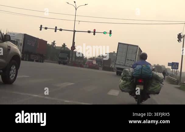 Street scenes in Hai Phong city. Traffic flows continuously at ...