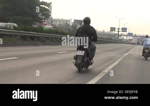 Street scenes in Hai Phong city. Traffic flows continuously at ...