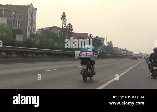 Street scenes in Hai Phong city. Traffic flows continuously at ...