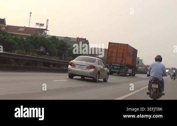 Street scenes in Hai Phong city. Traffic flows continuously at ...