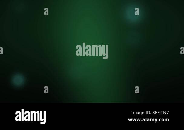 Glowing green light in dark background Stock Video Footage - Alamy