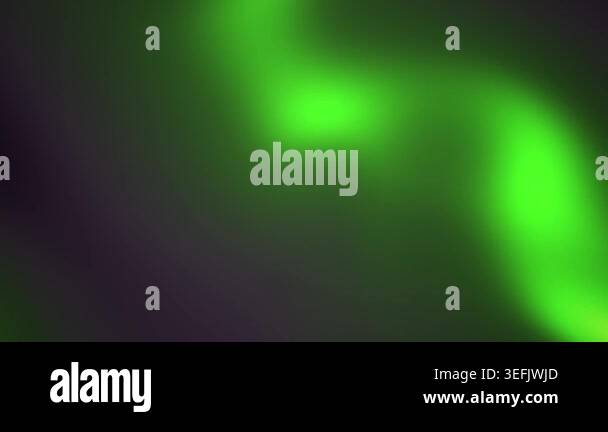 Glowing green light on dark background Stock Video Footage - Alamy