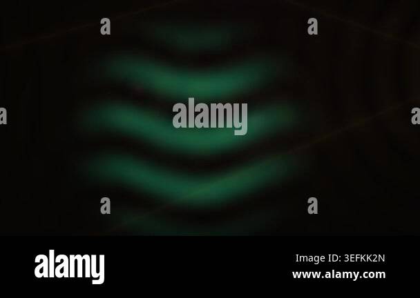 Glowing green light on dark background Stock Video Footage - Alamy