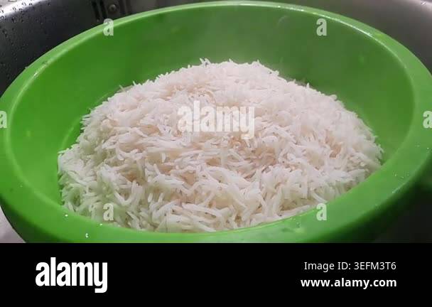 White Basmati rice on green plastic basket isolated video footage ...