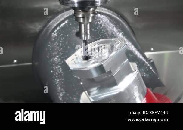 Close-up of a 5-axis CNC milling machine machining an aluminum ...