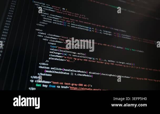 Colorful programming text scrolls automatically across a dark computer ...