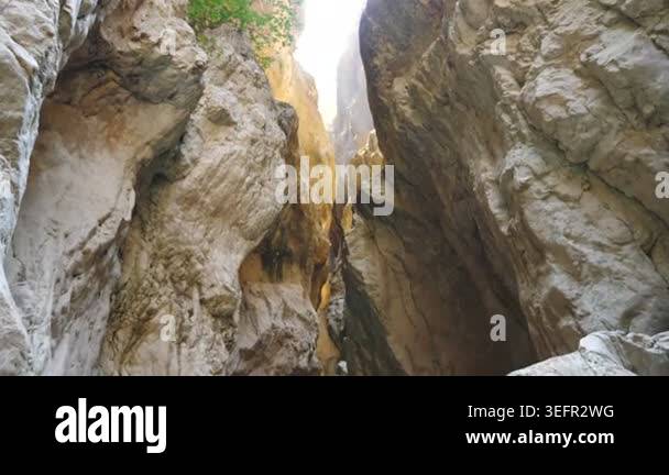 Beautiful view of high gray cliffs. Bright sky light illuminating rocky ...