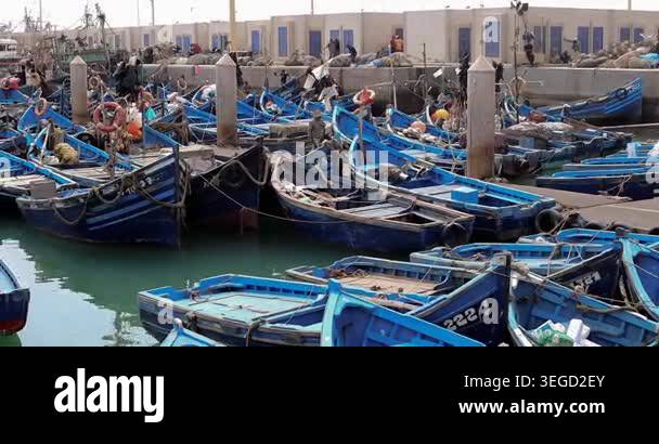 ESSAOUIRA, MOROCCO - April 20, 2026: Blue painted boats in the port of ...