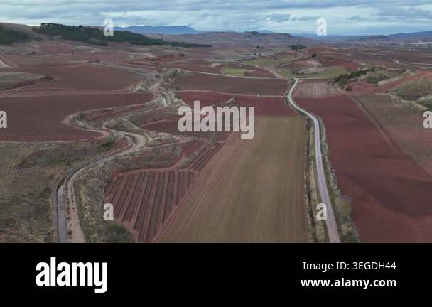Aerial top down view of a concrete irrigation water channel curving ...