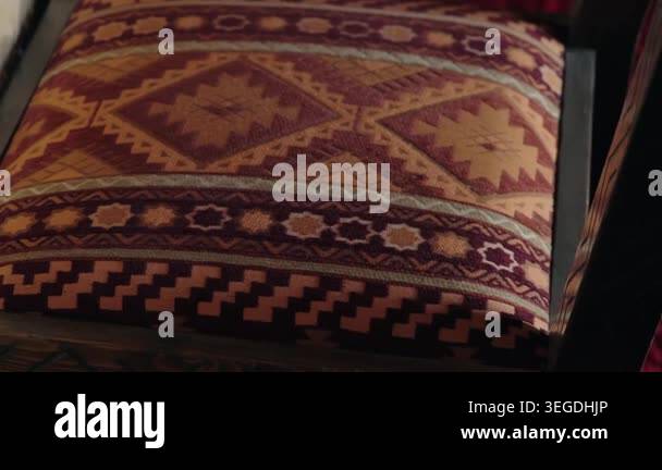 Close-up of an ornate chair cushion with traditional Moroccan patterns ...