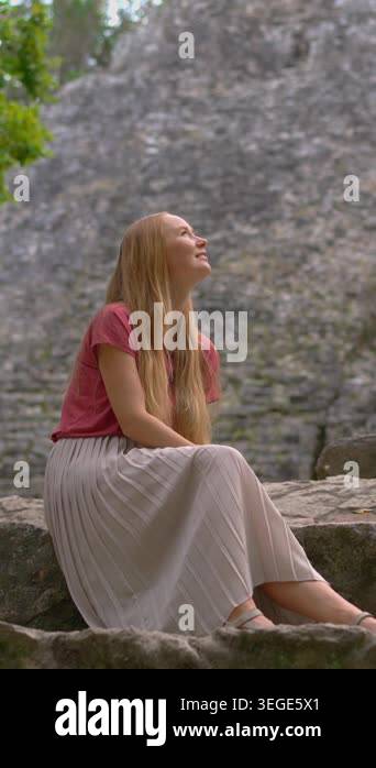 Young woman tourist exploring ancient Maya ruins in Latin America ...