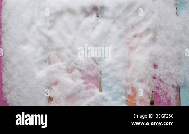 Snow covers a bright wooden surface in a winter setting Stock Video ...