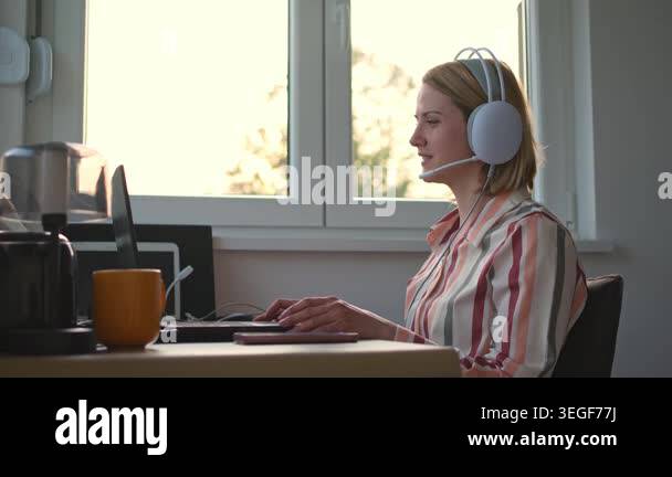 Call center agent woman working from home office and talking with a ...