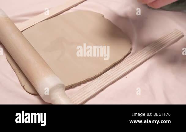Artist Rolling Clay Slab with Rolling Pin 4K Video Slow Motion. Artist ...