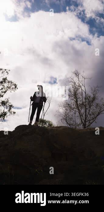 young woman climbing on mountain with blue sky and clouds Stock Video ...