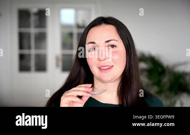 Warm natural light portrait of smiling woman comfortably displaying her ...