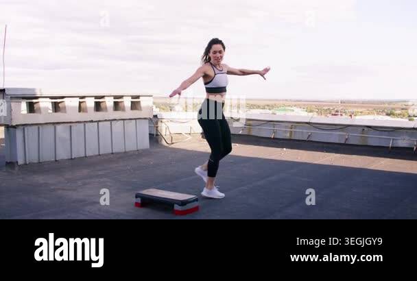 Fitness female dancing. Outside training. Smiling athlete showing ...