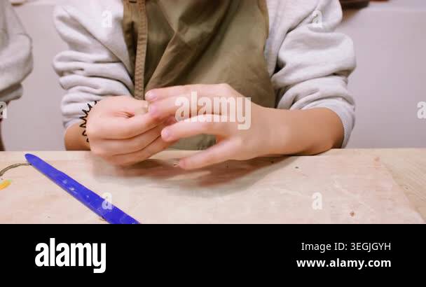Clay sculpting. Handmade ceramics. Unrecognizable creative children ...