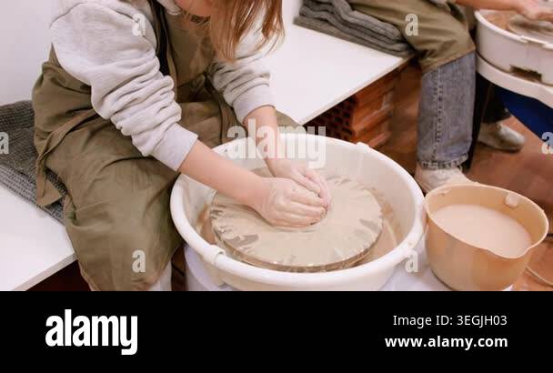 Diy ceramics. Pottery lesson. Talented children forming clay using ...