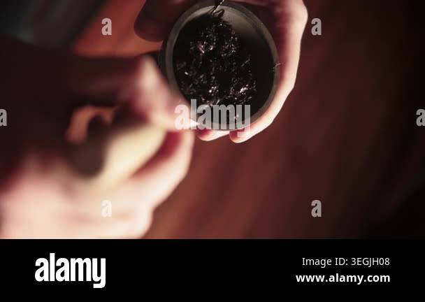 Traditional hookah. Ritual preparing. Man hands blending fruit tobacco ...