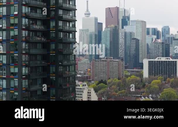 Contemporary dark facade apartment building slowly rising revealing ...