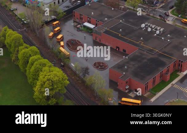 Yellow school buses parked in schoolyard after students transportation ...