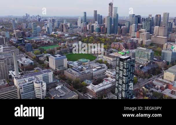 Descending perspective above University of Toronto campus revealing ...