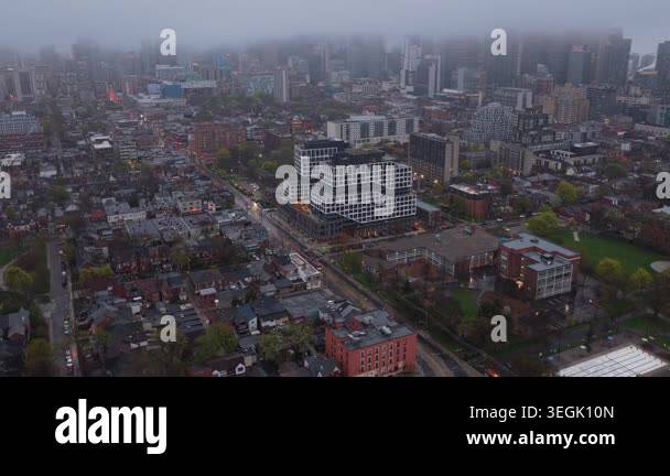 Foggy downtown Toronto skyline revealing city streets, urban ...
