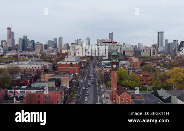 Aerial shot over downtown Toronto with traffic on a downtown street ...