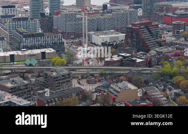 Urban development with modern buildings and construction crane, high ...