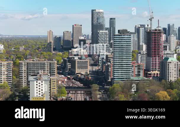 Urban skyline featuring towers, modern skyscrapers, bustling railway ...