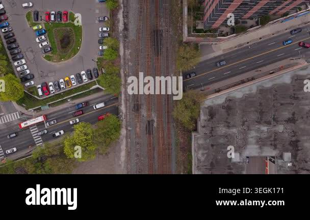 Overhead shot rotating above bustling urban landscape with busy city ...