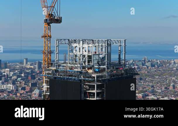 Crane building skyscraper in downtown Toronto, showcasing modern ...