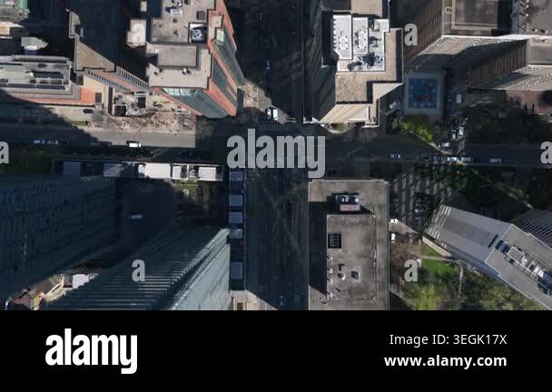 High altitude flight above downtown area with modern skyscrapers, busy ...