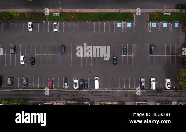 Top down aerial of car parking lot with empty spaces in North America ...