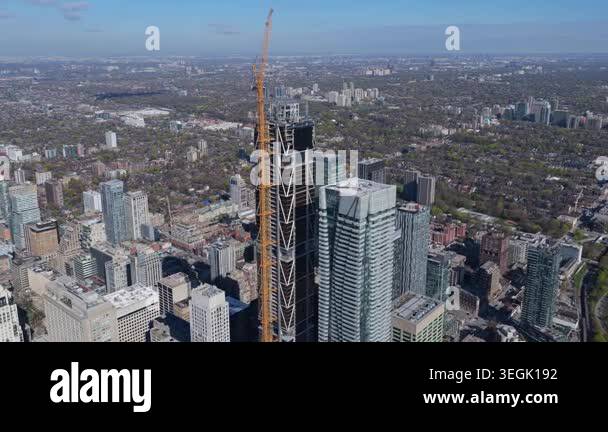 Urban development with skyscraper under construction, modern ...