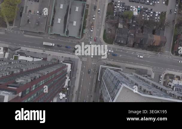 Top down shot of urban traffic at busy downtown area intersection with ...