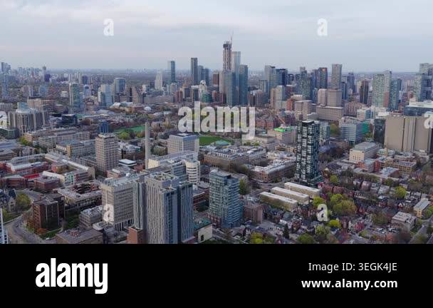 Flying over Torontos iconic skyline revealing urban development, modern ...