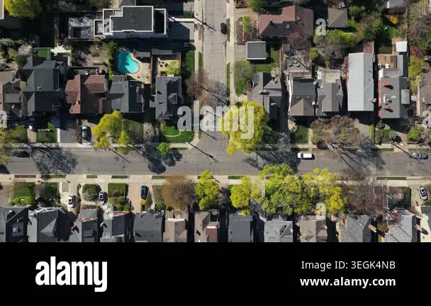 Top down showing residential area with cars driving on streets, houses ...