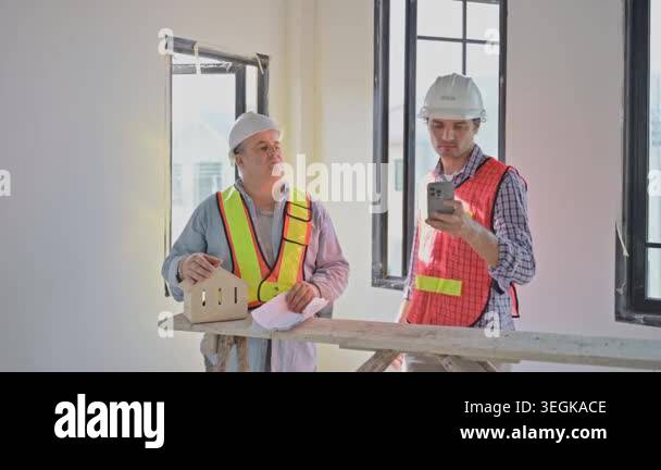 Professional male construction worker team wearing safety helmet ...