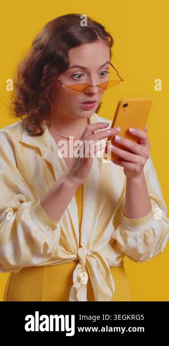 Happy excited joyful woman lady use smartphone typing browsing shouting ...