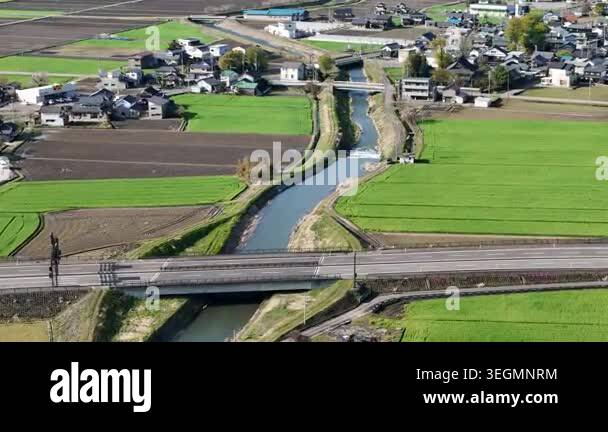 Aerial view of river flowing through fields Stock Video Footage - Alamy