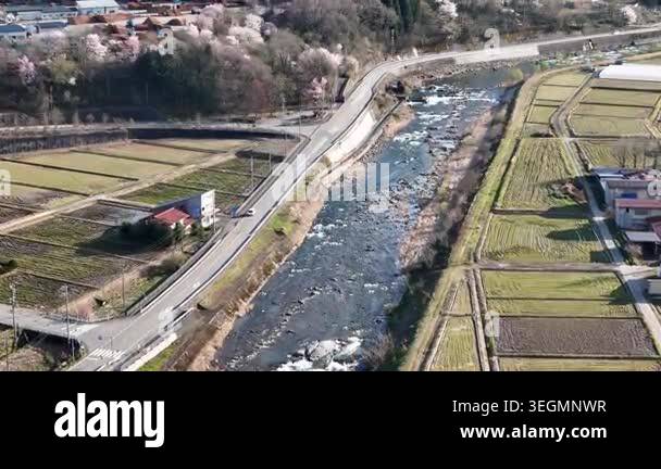 Aerial view of river and fields landscape Stock Video Footage - Alamy