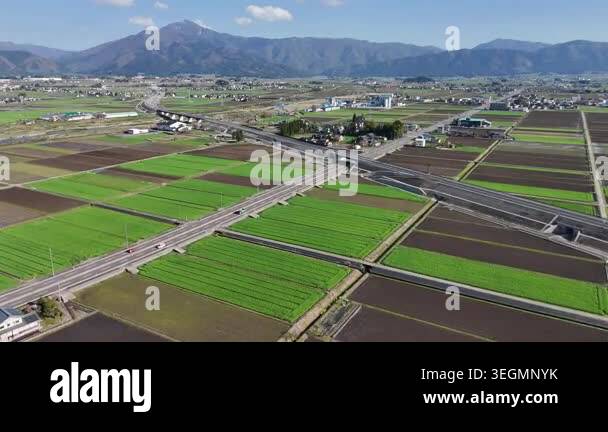 Aerial view of green fields and roads Stock Video Footage - Alamy