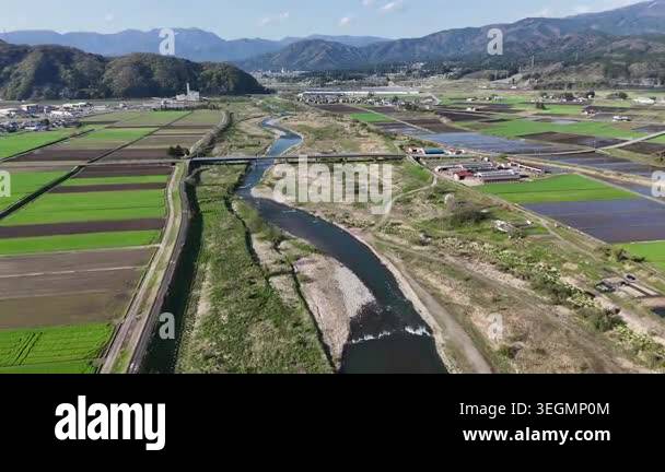 Aerial view of river and green fields Stock Video Footage - Alamy