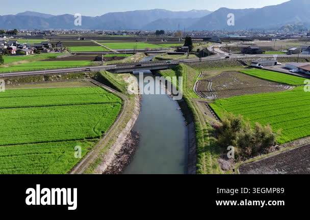 Aerial view of river and green fields Stock Video Footage - Alamy