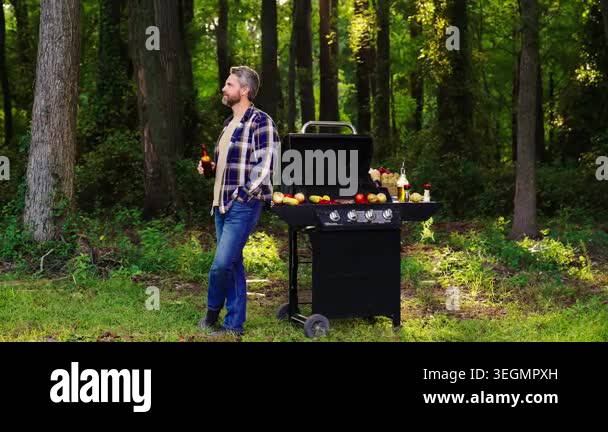 Barbeque grill with summer sunlight. Cooking meat on the grill during ...