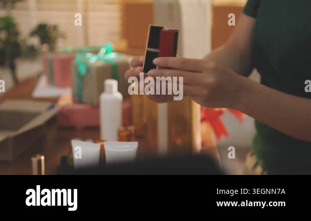 woman hand holding a gift box with a ribbon Stock Video Footage - Alamy